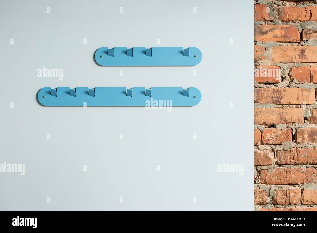 Metal blue hangers Stock Photo - Alamy