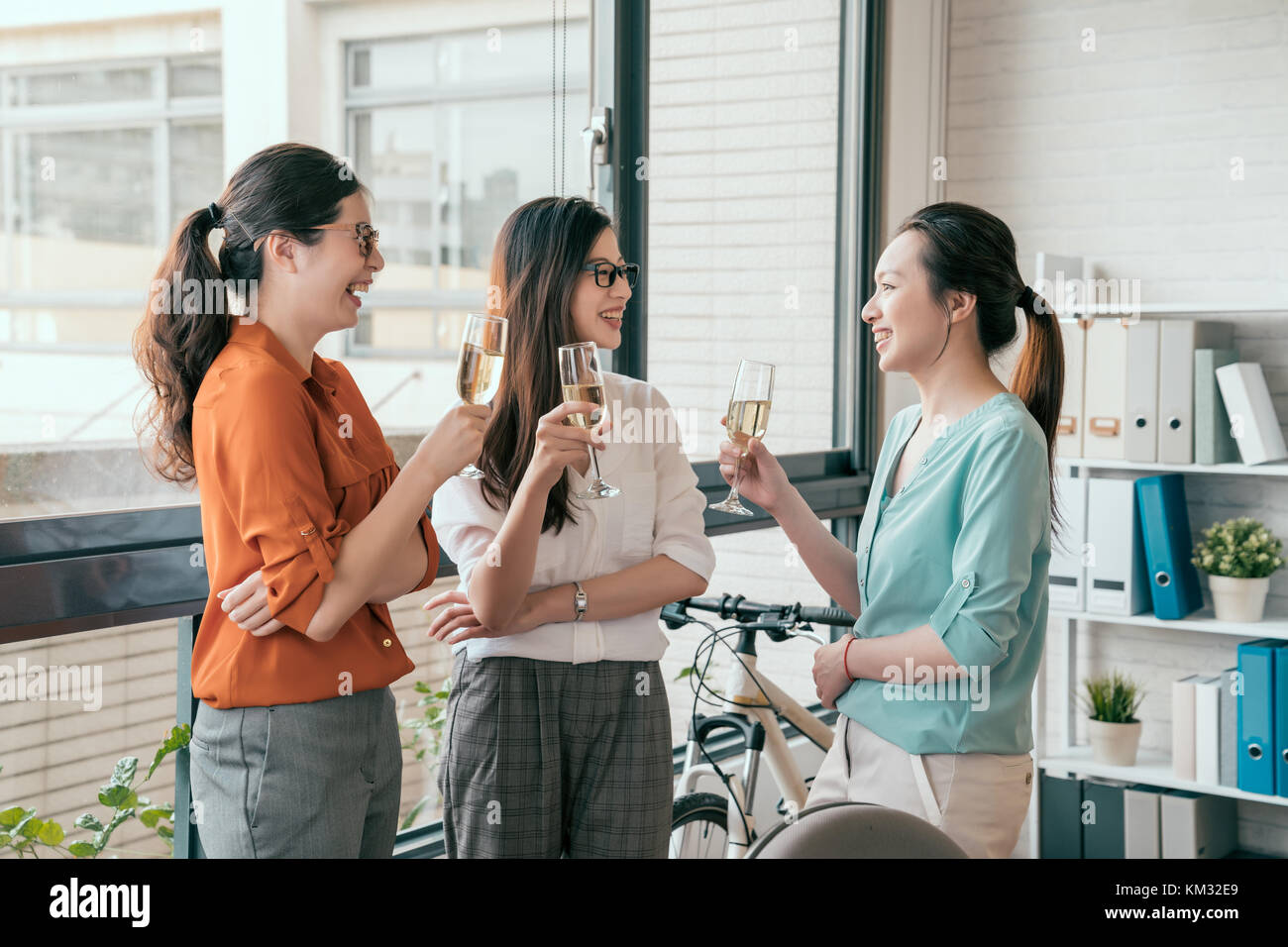 Toasting to success. Group of business people toasting with champagne ...