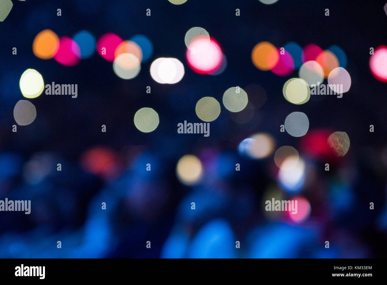 Colorful bokeh concert lights, defocused shiny glowing stage lights ...