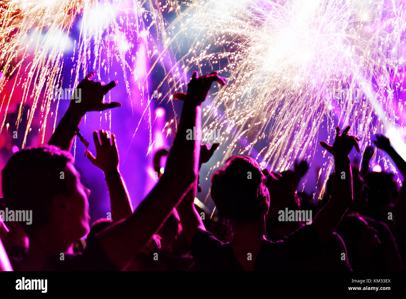 Cheering crowd and fireworks at New Year's Eve party Stock Photo - Alamy