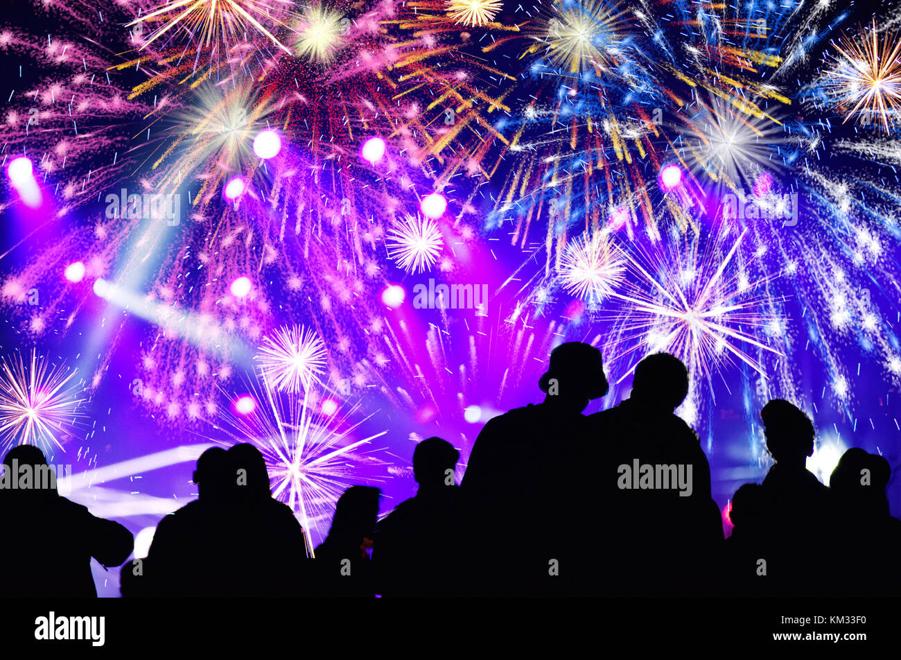 Cheering crowd and fireworks at New Year's Eve party Stock Photo - Alamy