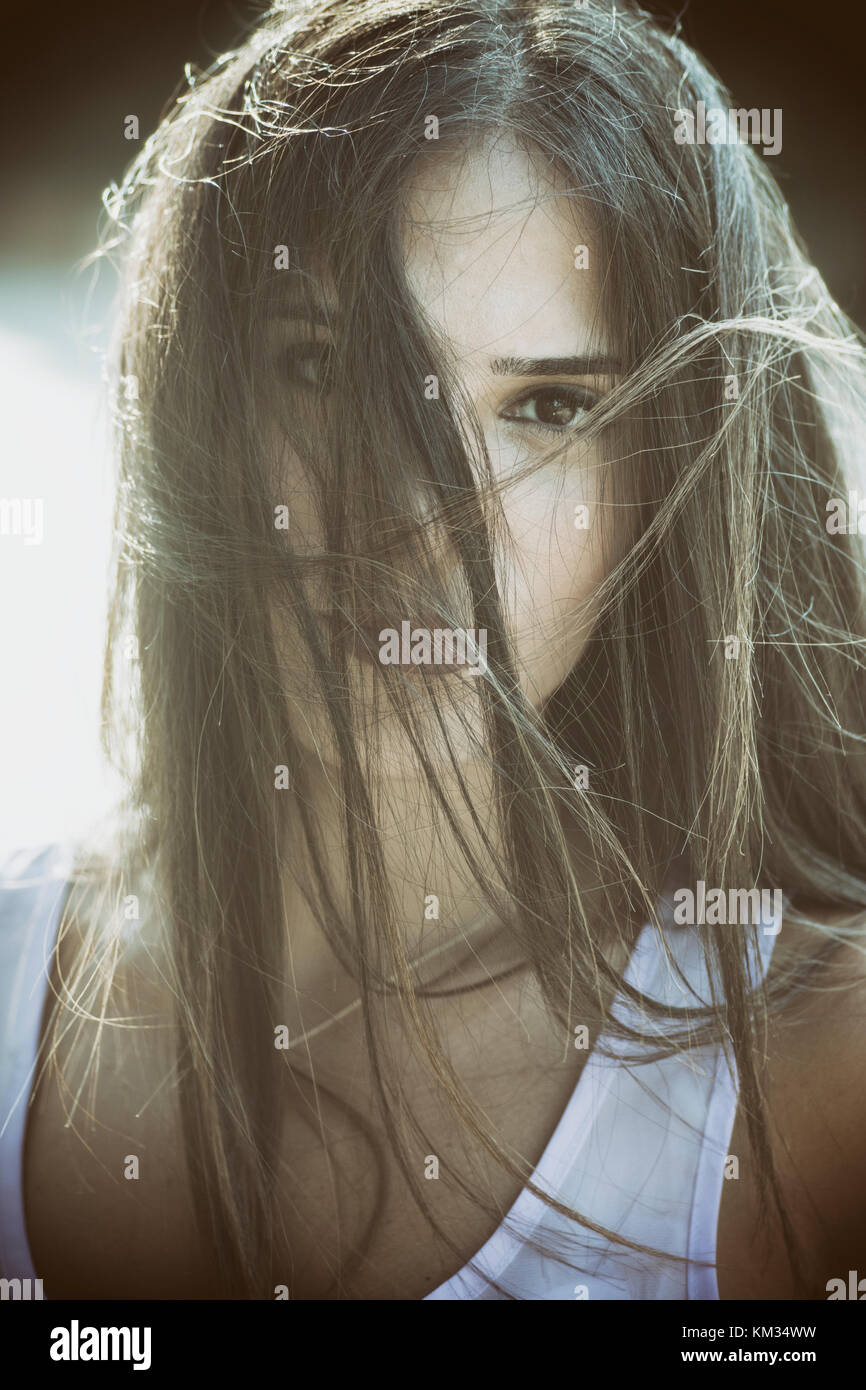Beautiful young woman hair covering face Stock Photo - Alamy