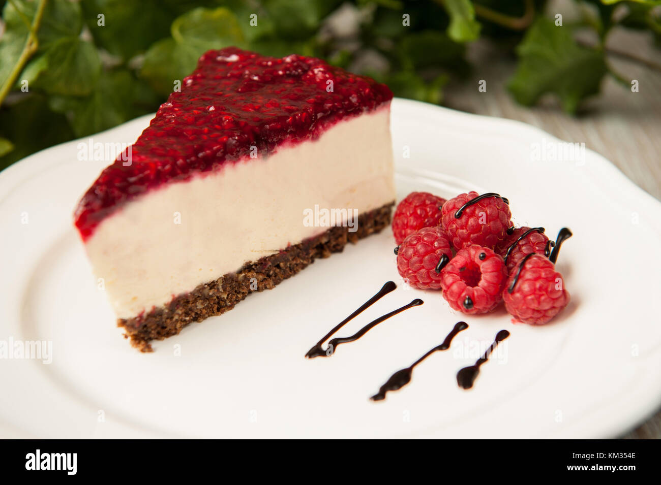 Slice of homemade cheesecake with raspberries Stock Photo - Alamy