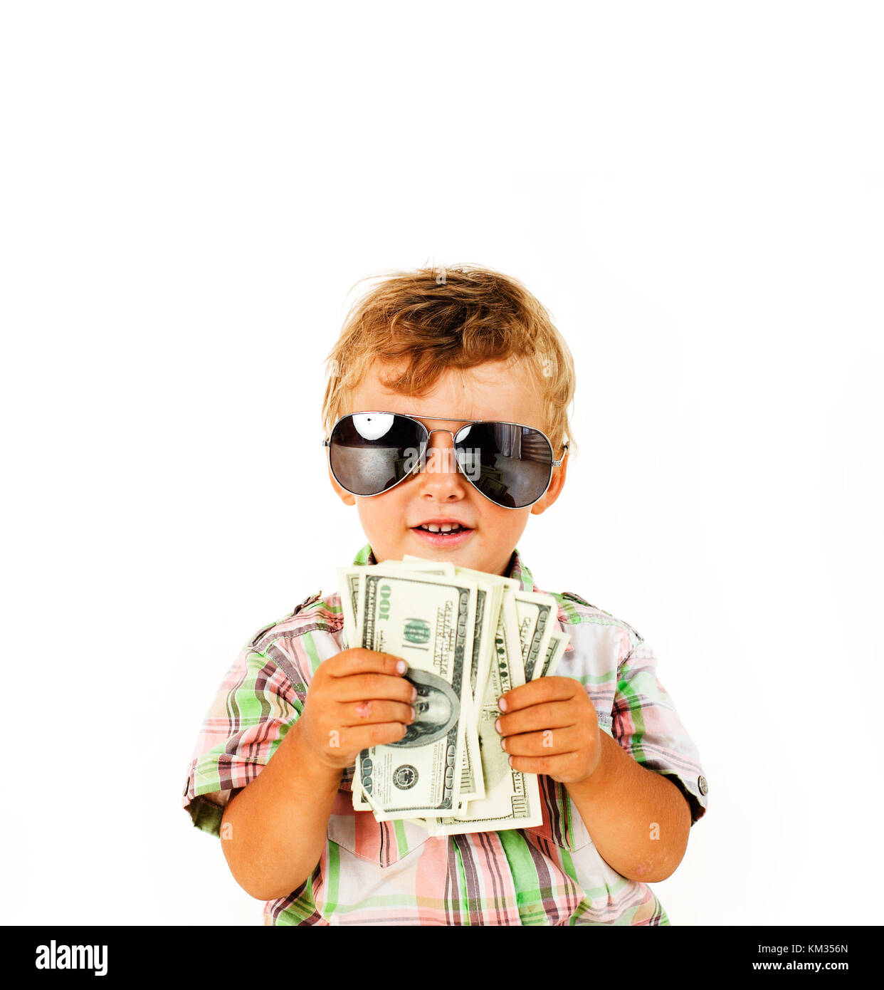young cute boy holding lot of cash, american dollars isolated close up ...