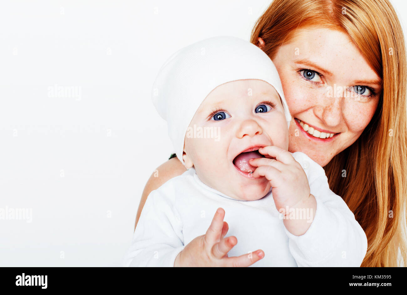 young beauty mother with baby, red head happy family isolated Stock ...