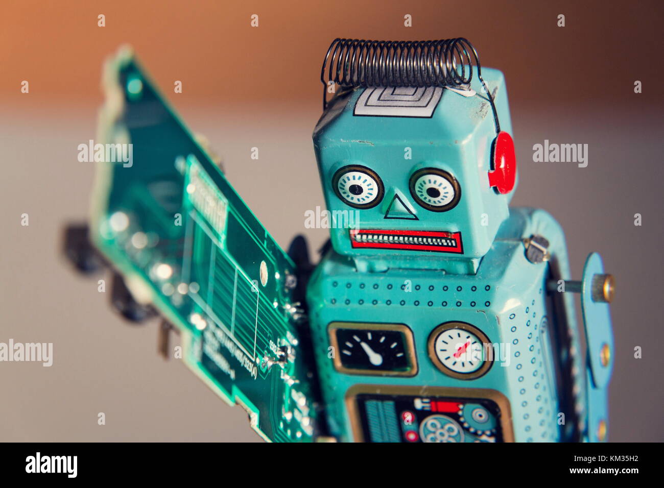 Tin toy robot carries computer circuit board, artificial intelligence ...