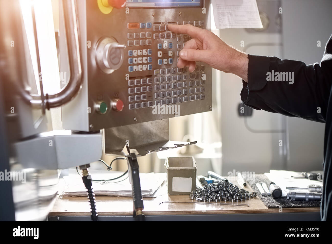 Cnc machine controls, male hand Stock Photo - Alamy
