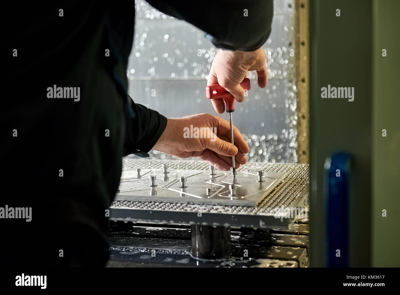 Man is using allen wrench Stock Photo - Alamy