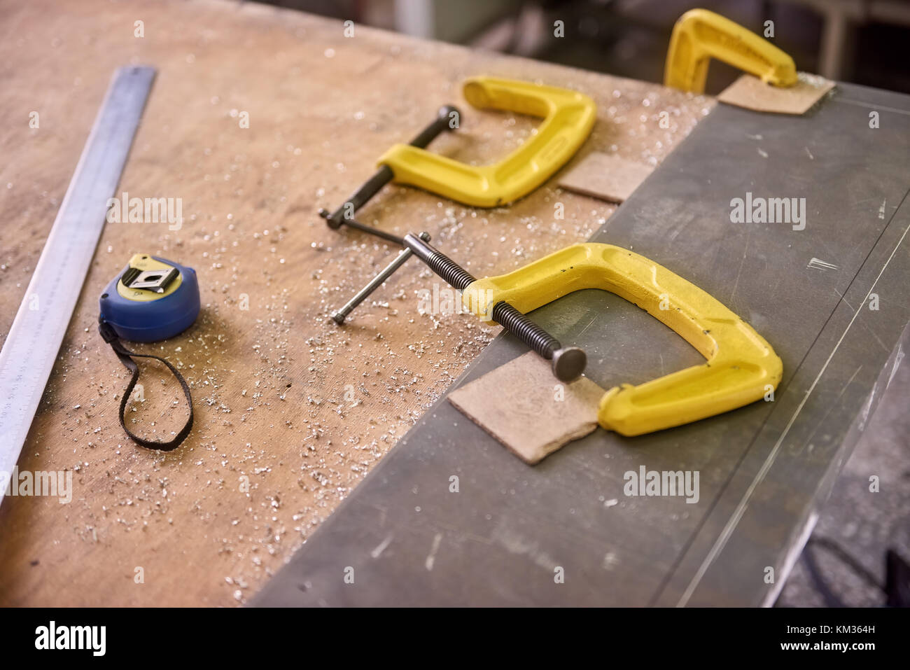 Two C-clamps, ruler and tape-measure Stock Photo - Alamy