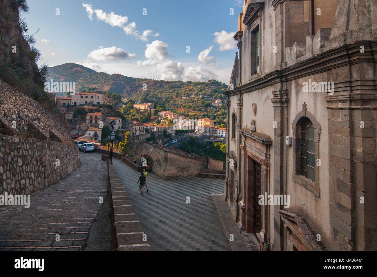 Tourists walk in the village of Savoca, Sicily, Italy. The town was the ...