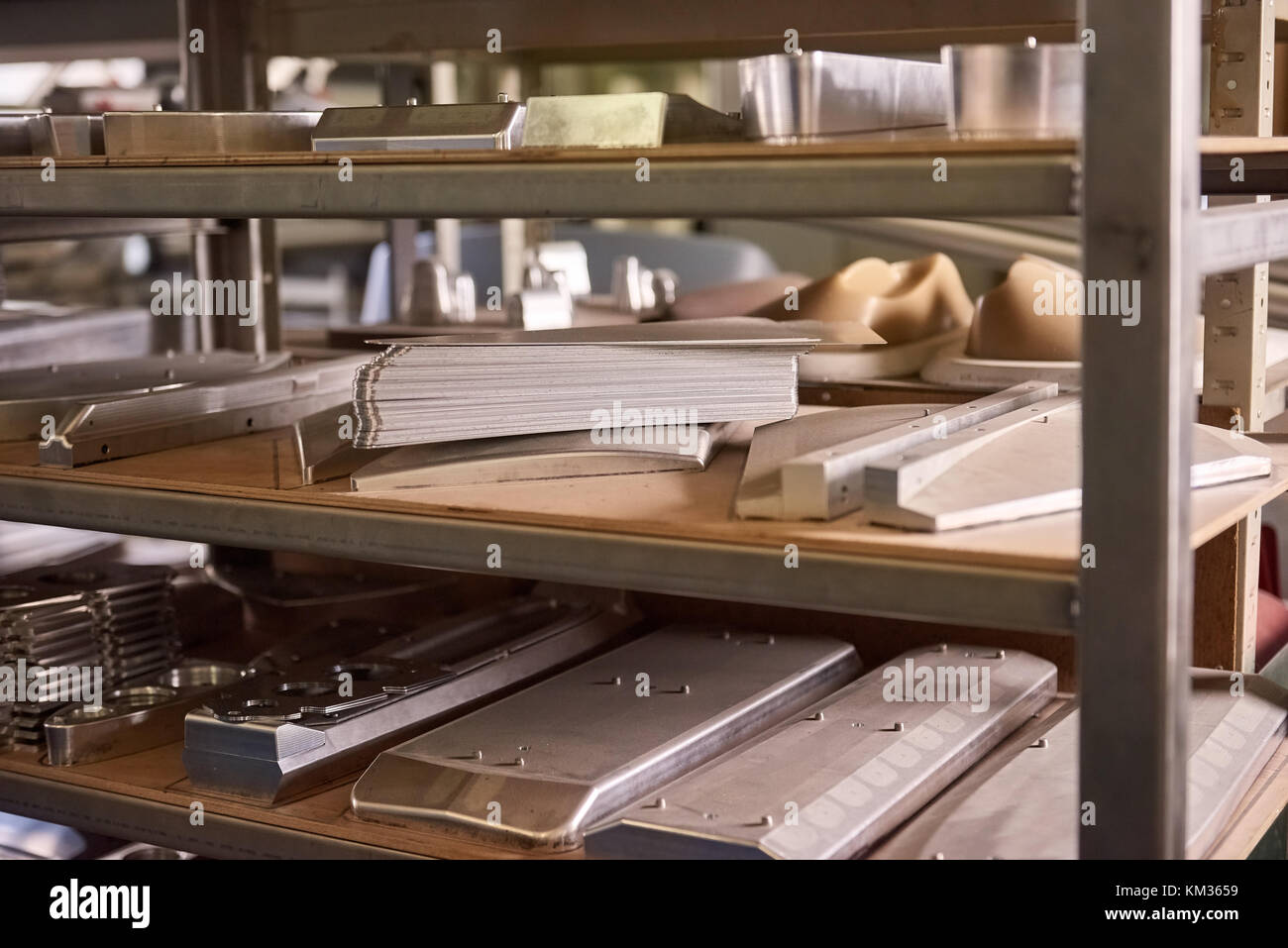 Steel parts on shelves Stock Photo - Alamy