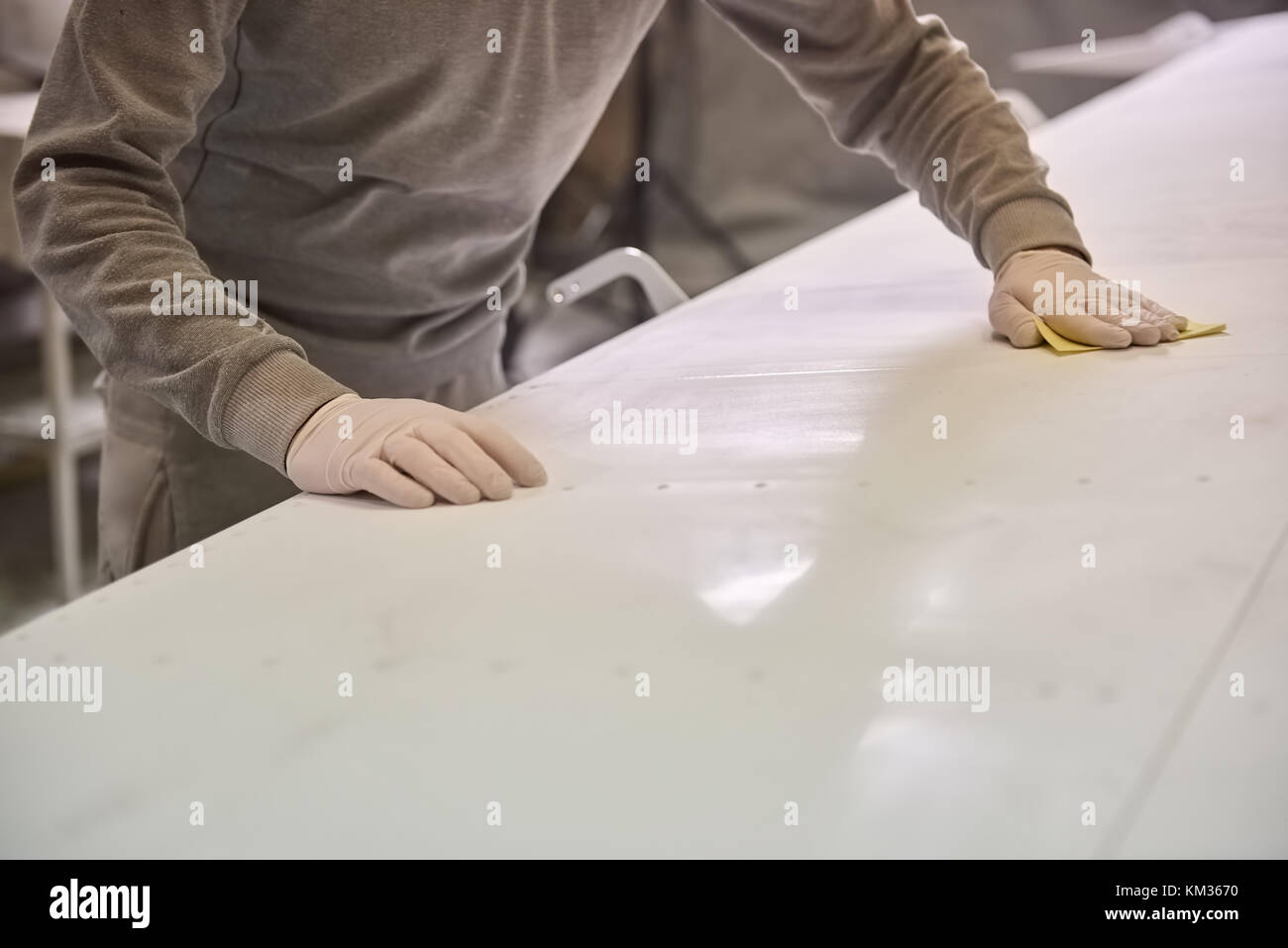 Man is cleaning white plate Stock Photo - Alamy