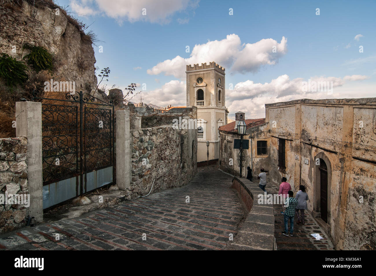Tourists walk in the village of Savoca, Sicily, Italy. The town was the ...