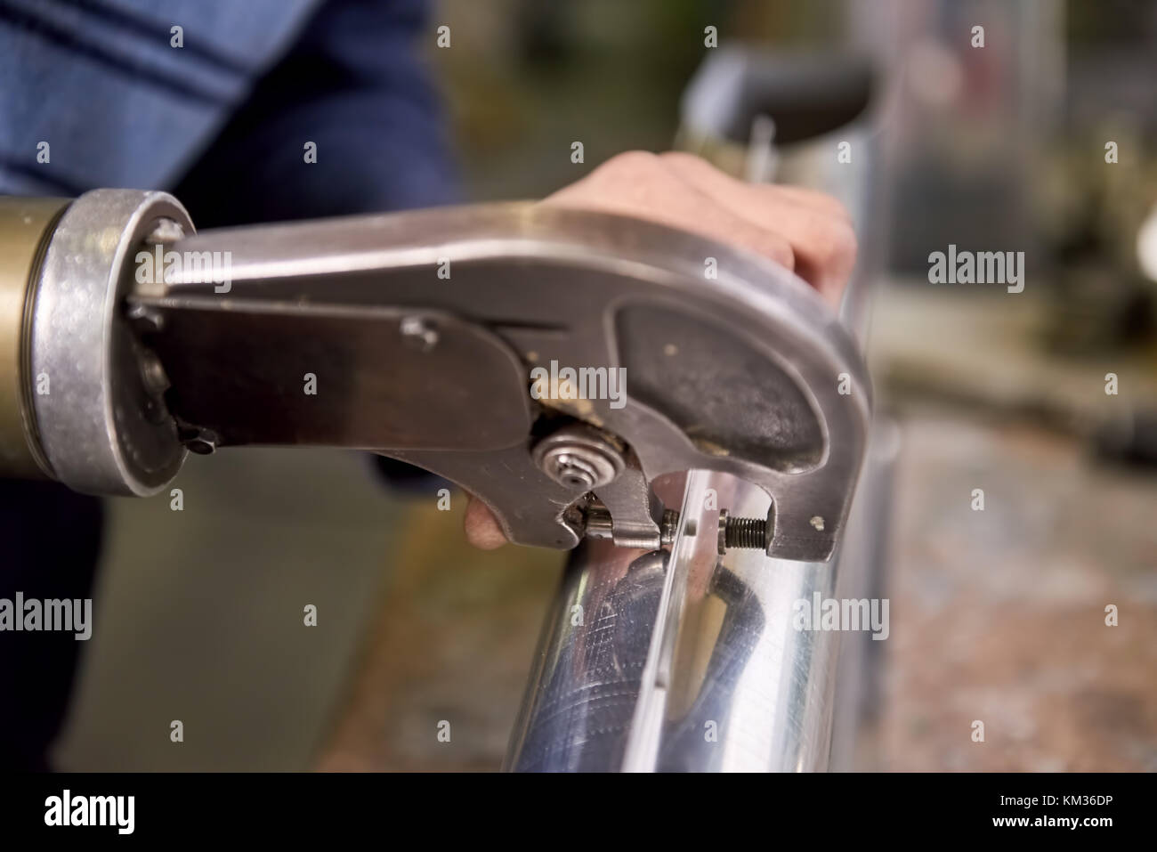 Rivet squeezer in action Stock Photo - Alamy