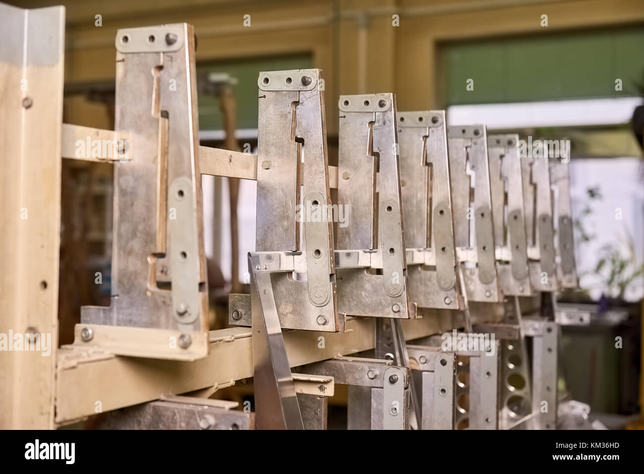 Row of identical metal details Stock Photo - Alamy