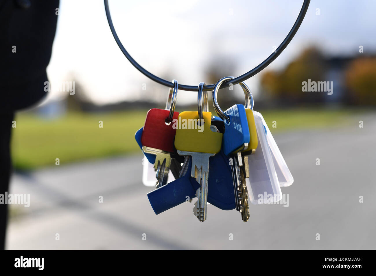 Hand holding bunch keys hi-res stock photography and images - Alamy