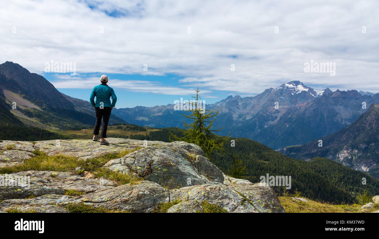 Hiker look a mountains Stock Photo - Alamy