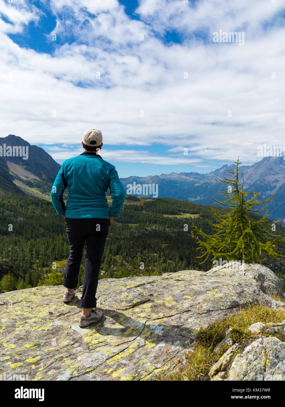 Hiker in mountain, back view Stock Photo - Alamy