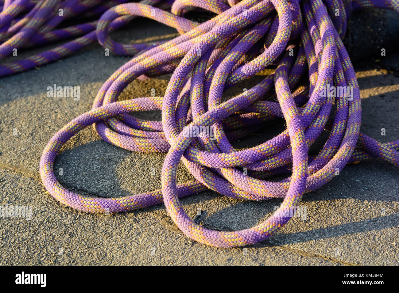 Close up braided climbing rope on asphalt Stock Photo - Alamy