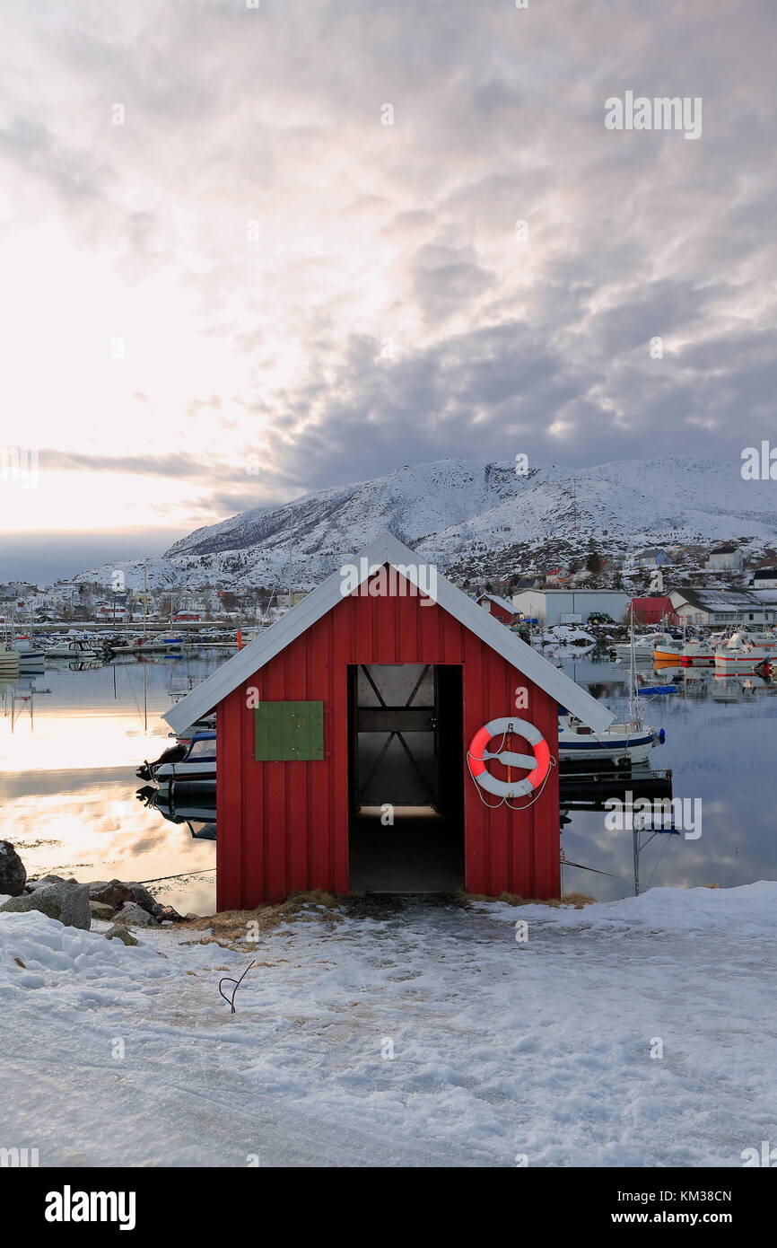 Red hut-breakwater of harbor full of fishing boats moored to floating ...