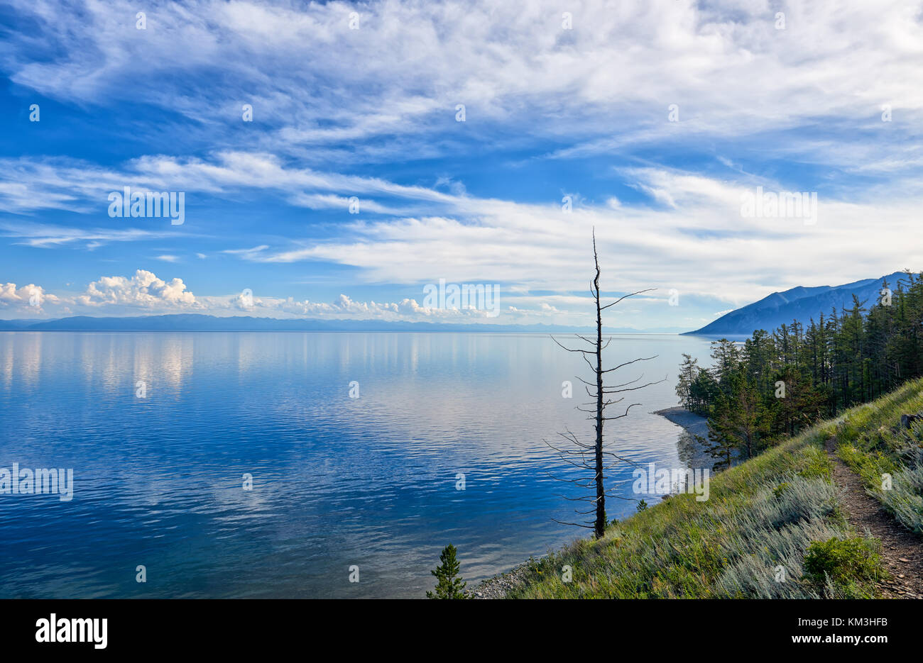 Baikal landscape. Deep blue lake and Siberian mountains on horizon ...