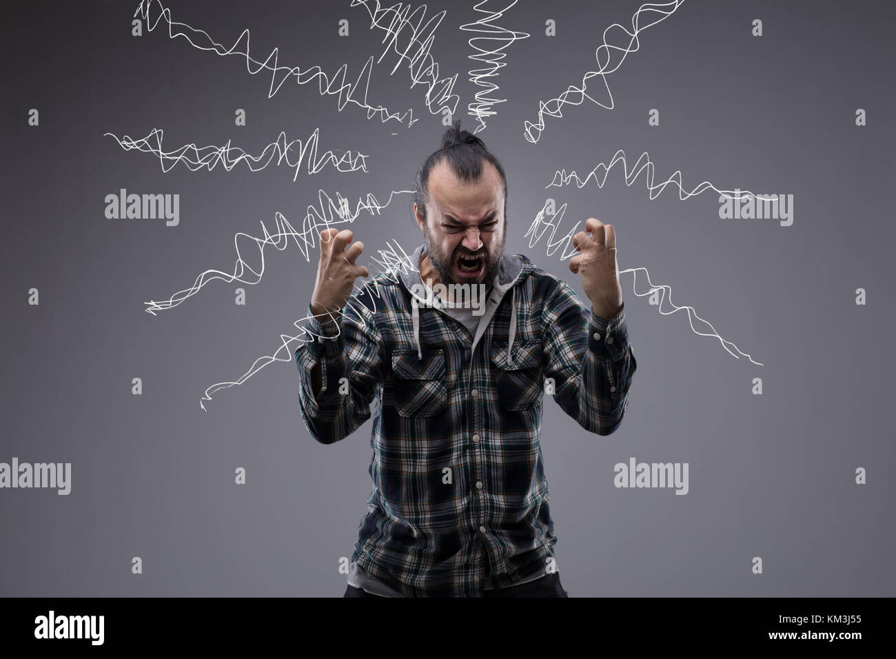 Man in a rage throwing a temper tantrum screaming and clenching his ...