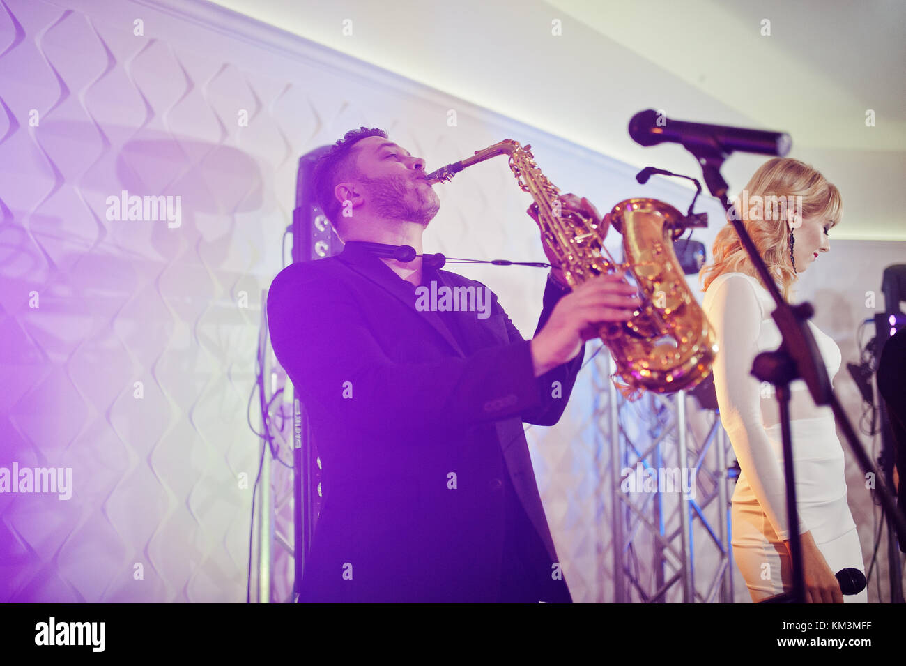 Musicial music live band performing on a stage with different lights ...