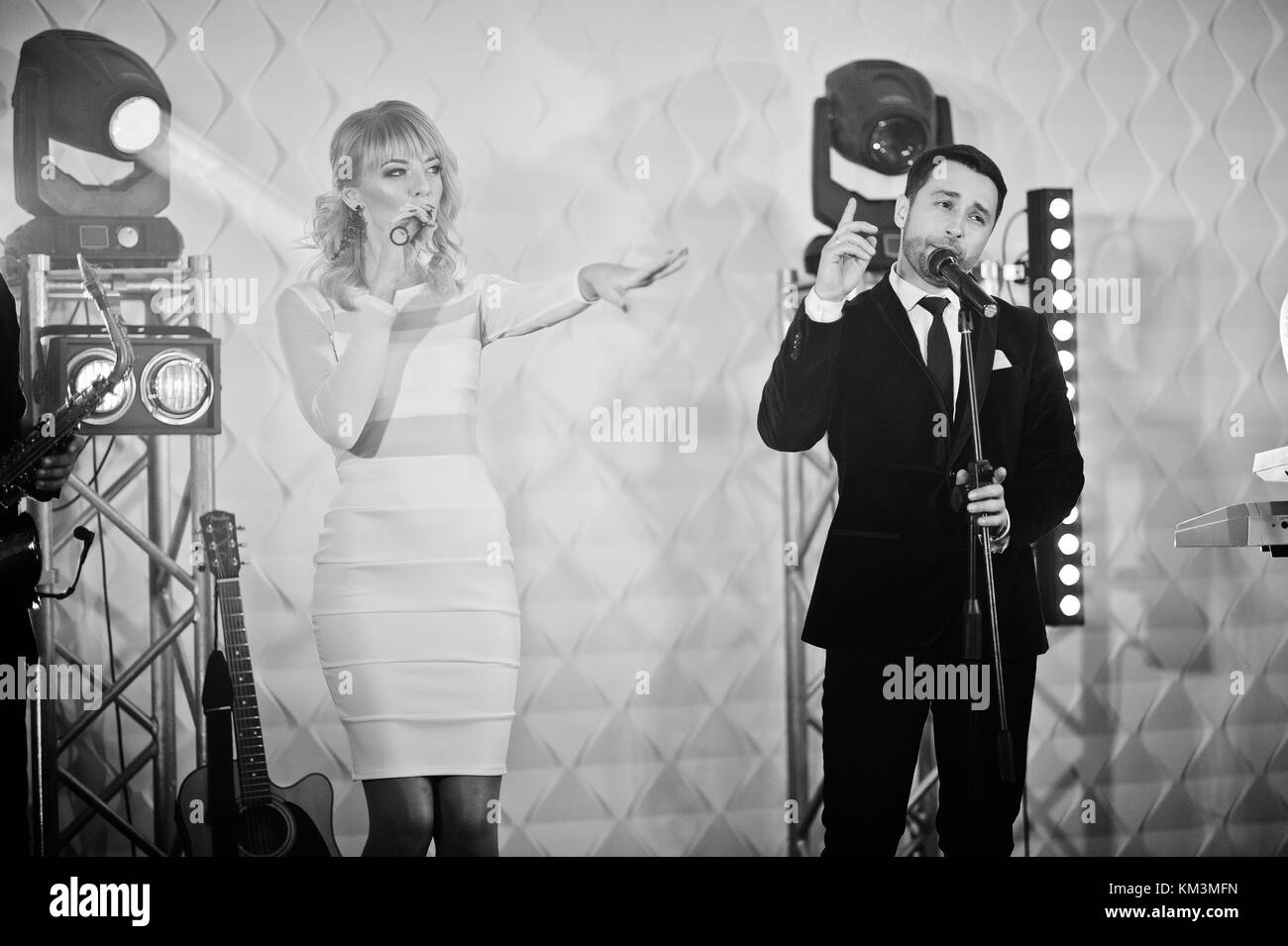Musicial music live band performing on a stage with different lights ...