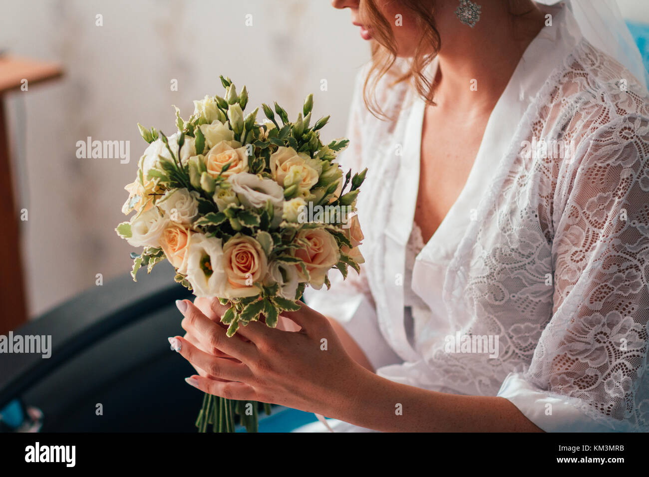 portrait of a young bride with a bouquet on a light background Stock ...