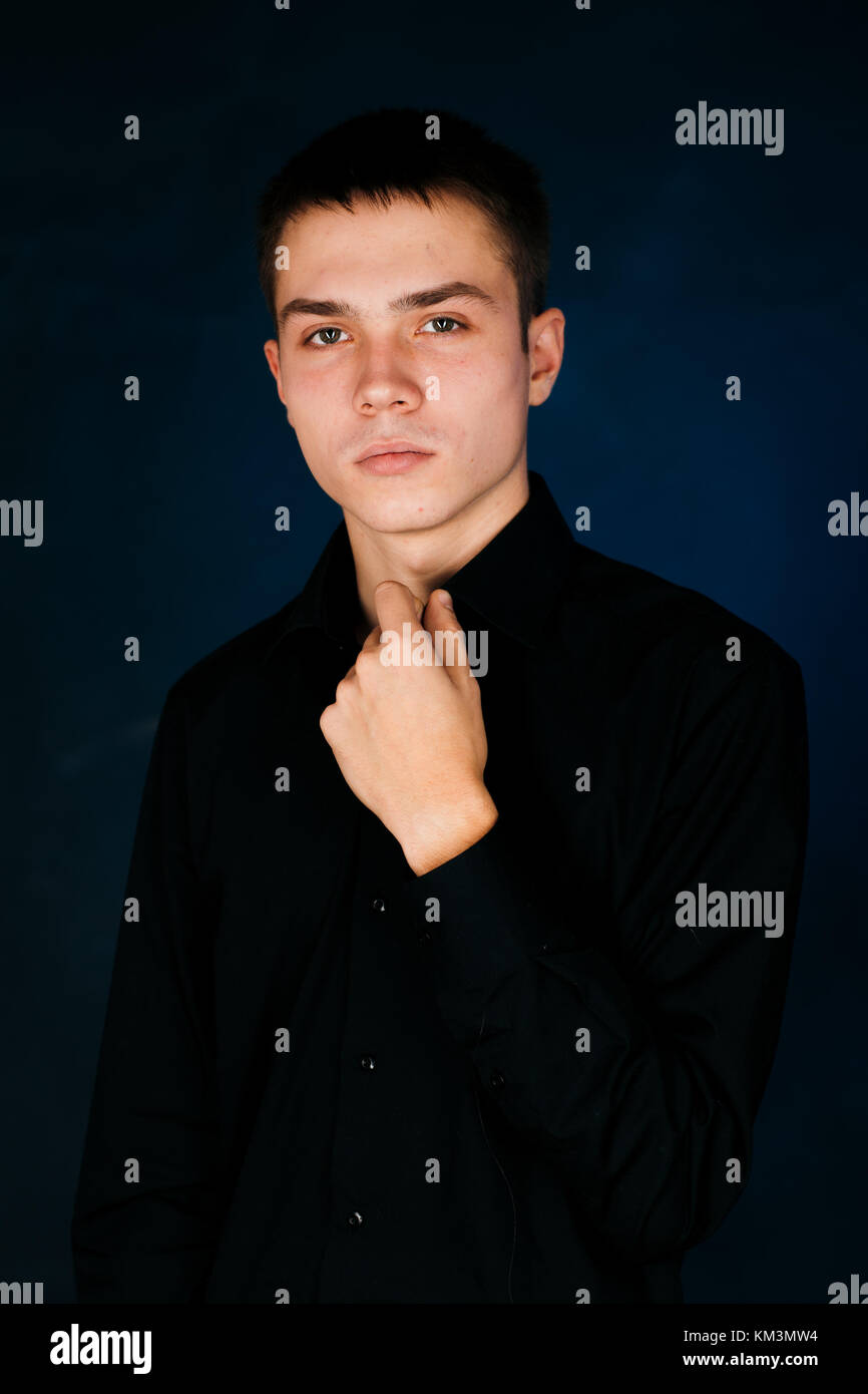 young guy on a dark studio background Stock Photo - Alamy