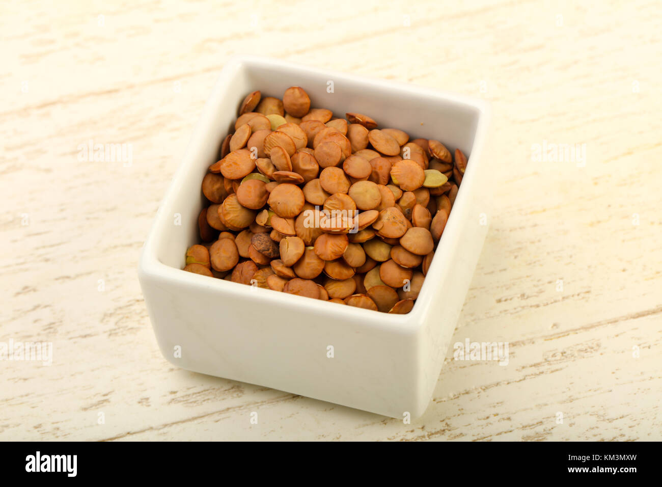 Raw lentils in the bowl ready for cooking Stock Photo - Alamy