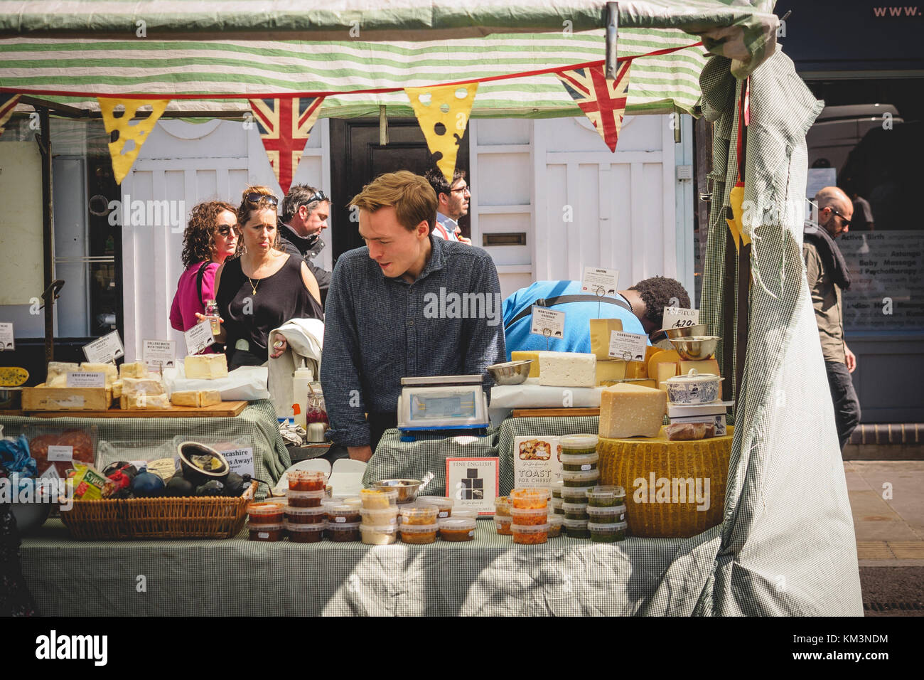 Street food stall selling cheese in Broadway Market in Hackney. East ...