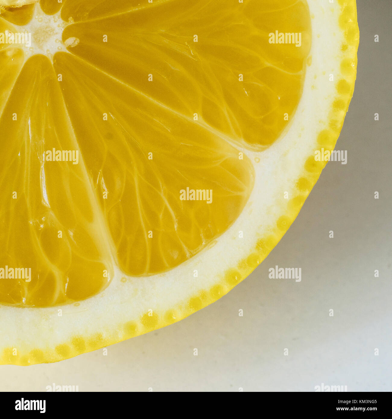 Portion of a slice of lemon isolated on white background. Square format ...