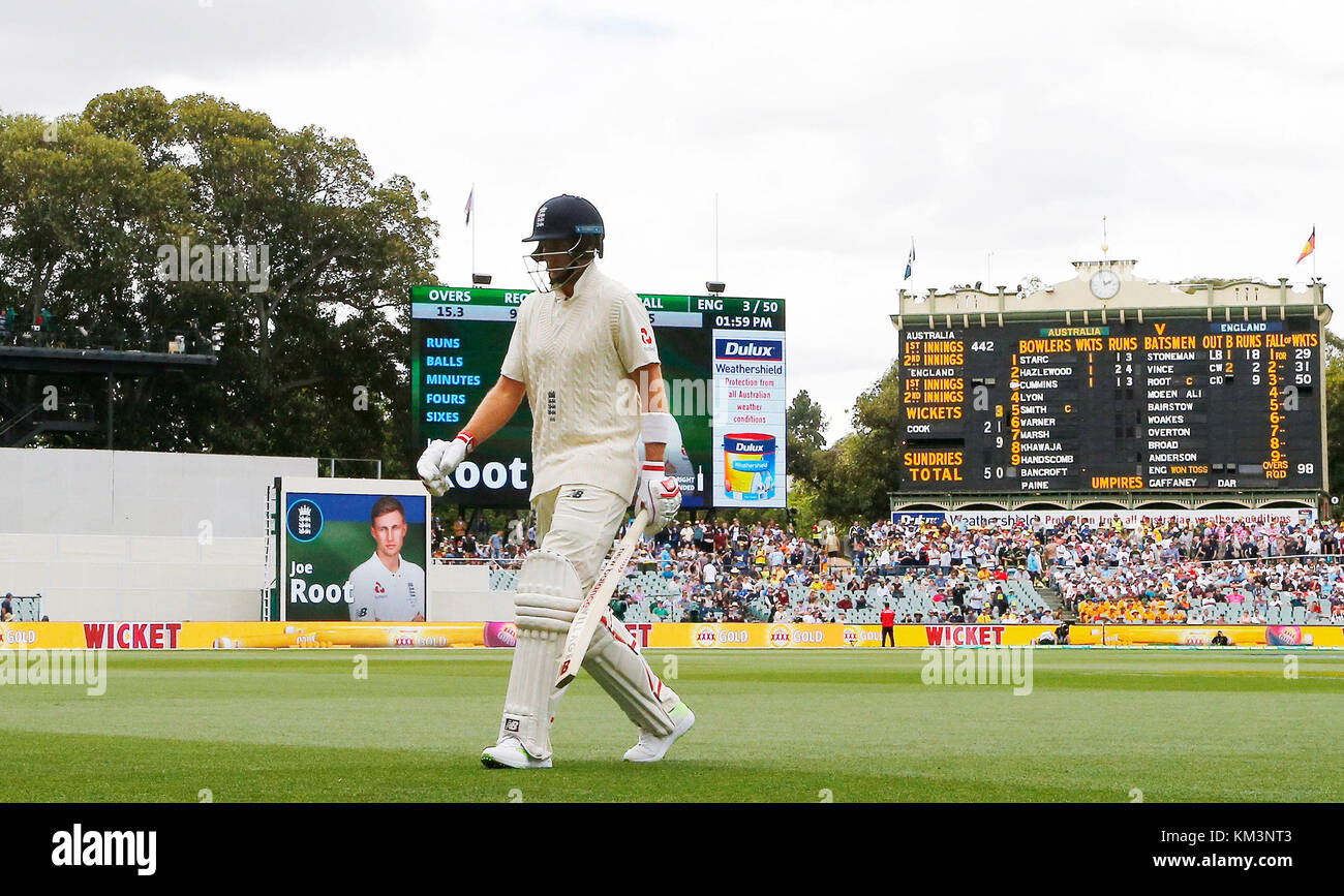 England's Joe Root looks dejected after Australia's Pat Cummins took ...