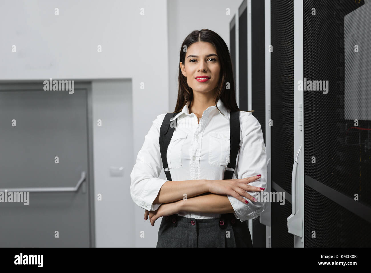Portrait of woman in server room Stock Photo - Alamy