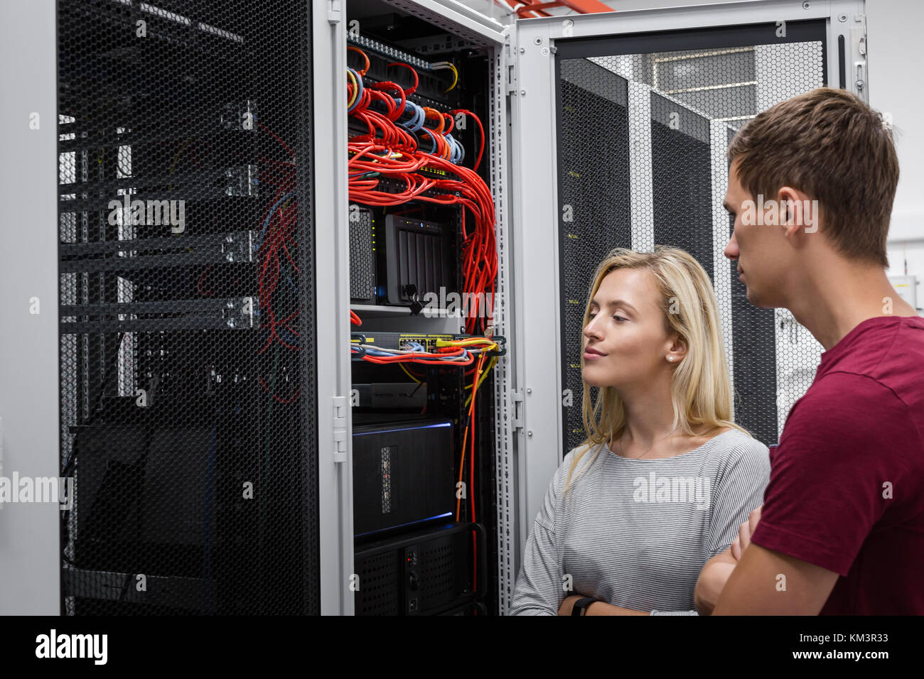 team of busienss people working in server room Stock Photo - Alamy