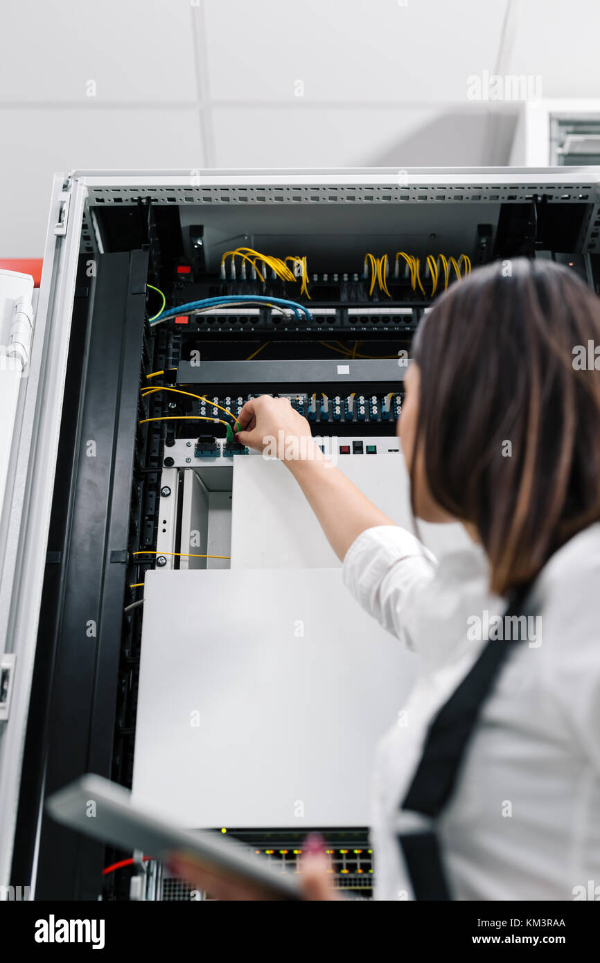 Portrait of a female executive in server room Stock Photo - Alamy
