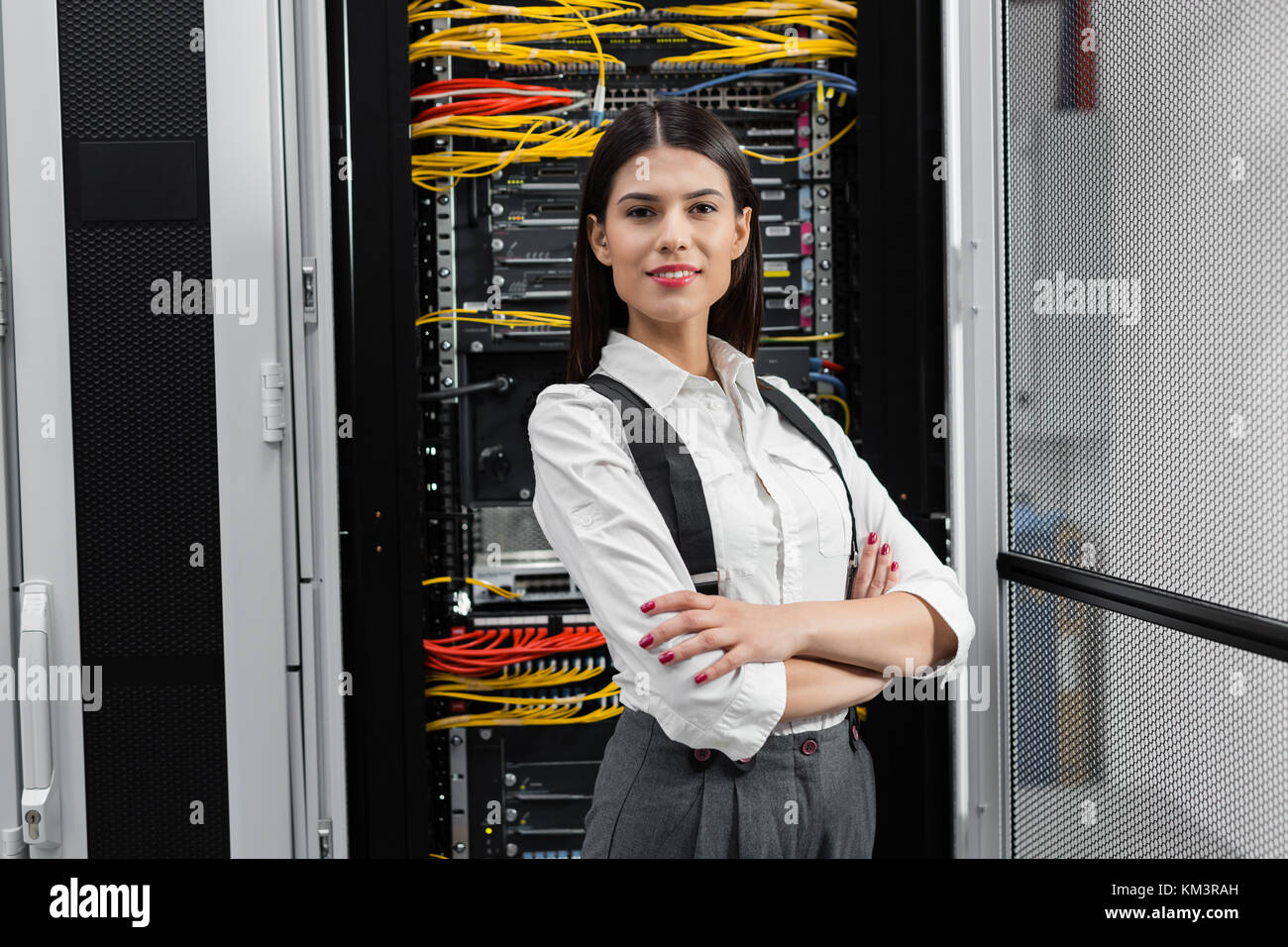 Portrait of woman in server room Stock Photo - Alamy