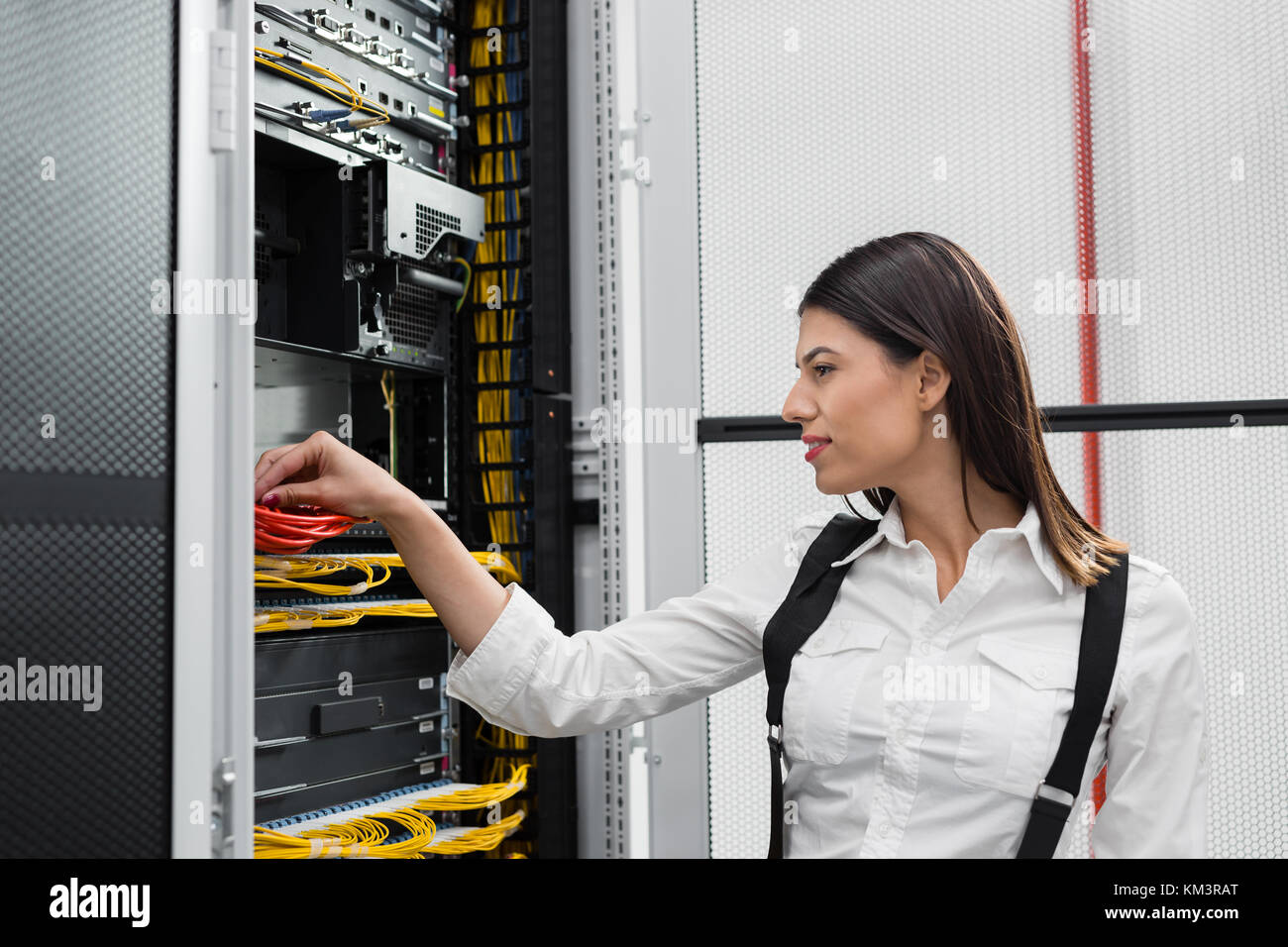 Young engineer businesswoman in network server room Stock Photo - Alamy