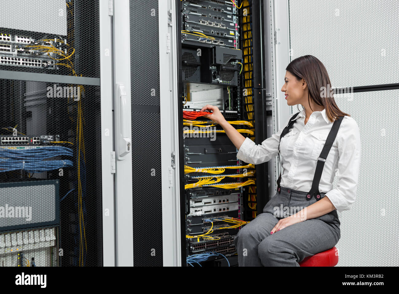 Young engineer businesswoman in network server room Stock Photo - Alamy