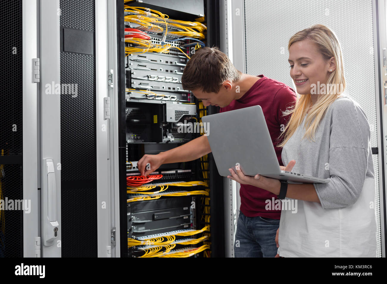 team of busienss people working in server room Stock Photo - Alamy