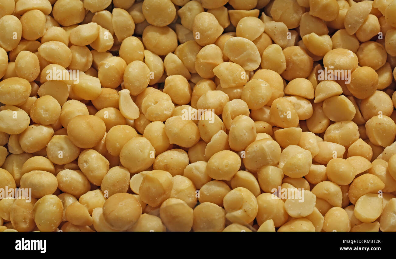 background of many macadamia seeds for sale Stock Photo - Alamy