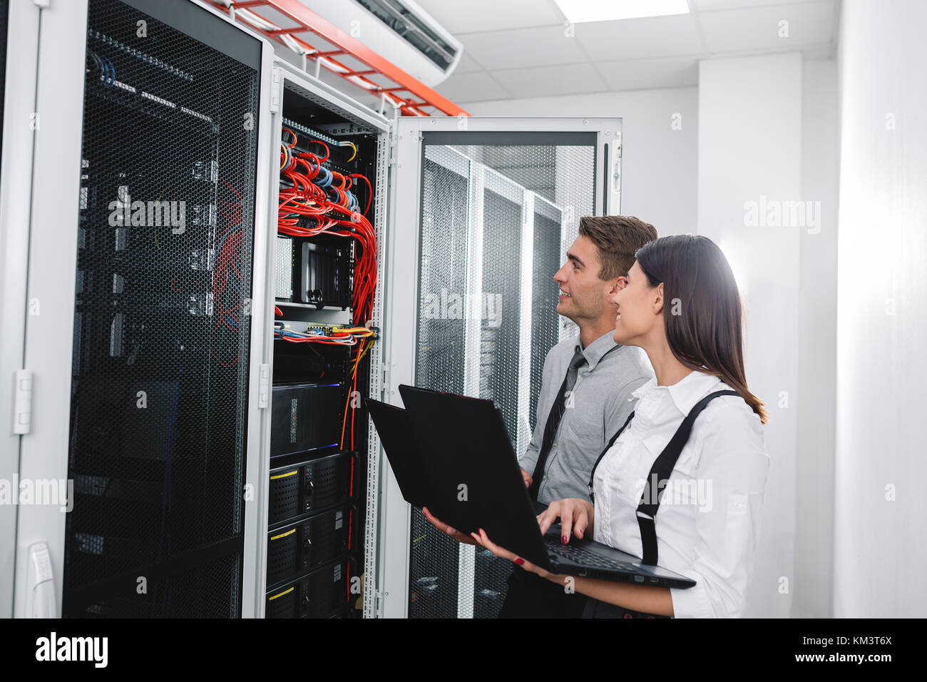 team of busienss people working in server room Stock Photo - Alamy