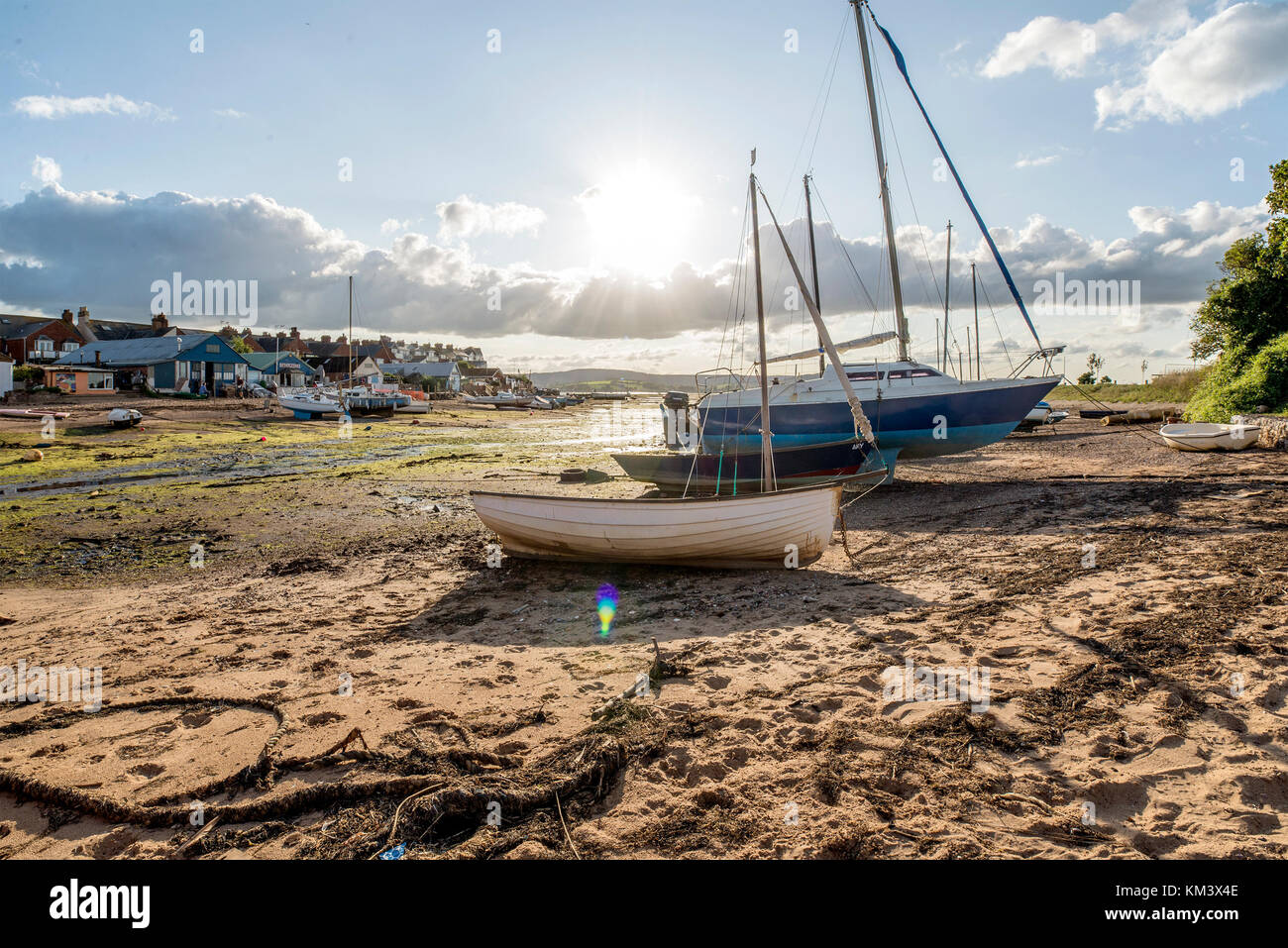 Boats Moored in Sunny Beach Scene Stock Photo - Alamy