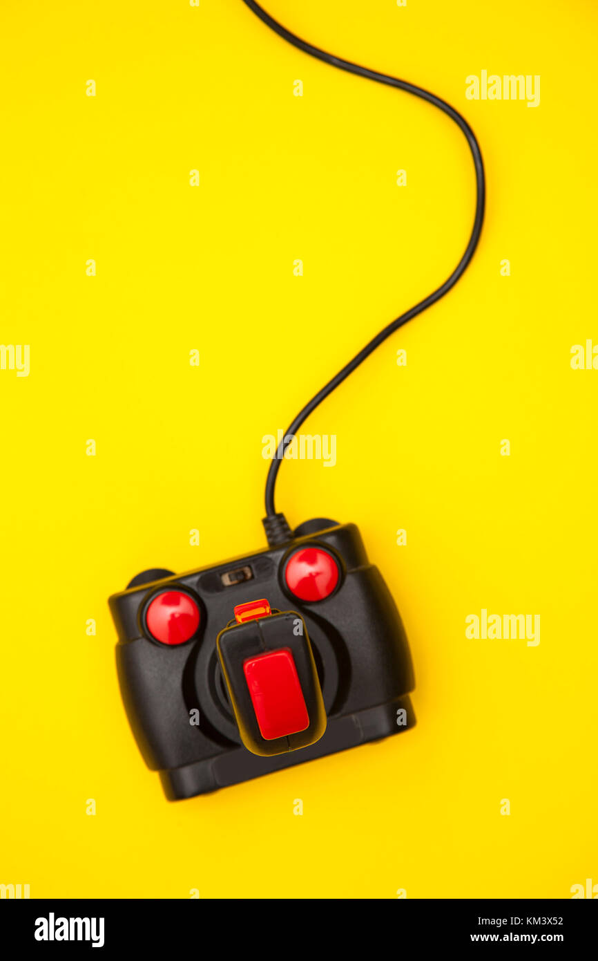 Retro computer gaming controller on a bright yellow background Stock ...