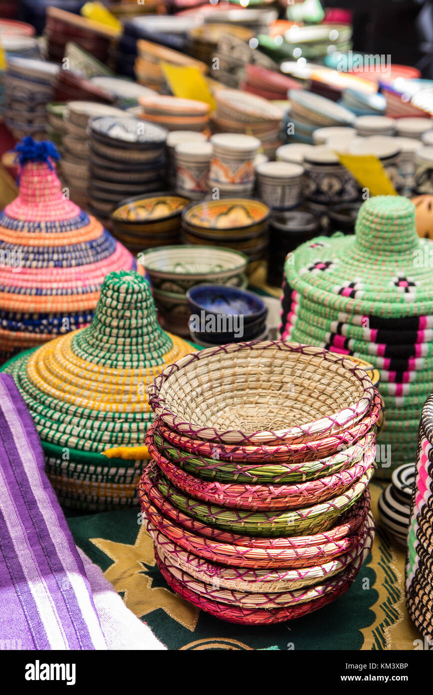 Jute baskets of different colours, souvenirs from Asia and Africa, for ...