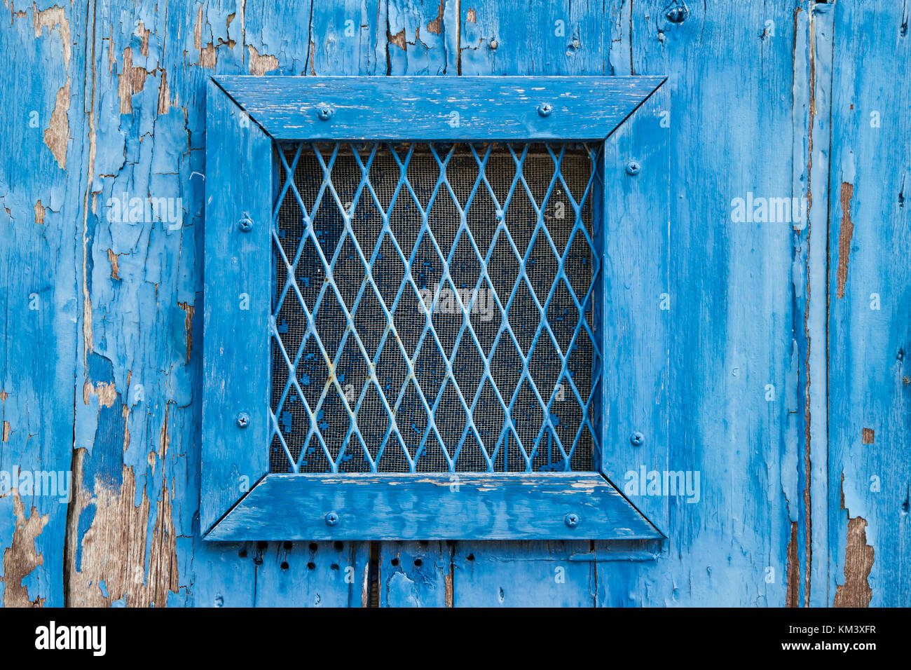 Decorative squared grid on blue wooden door Stock Photo - Alamy