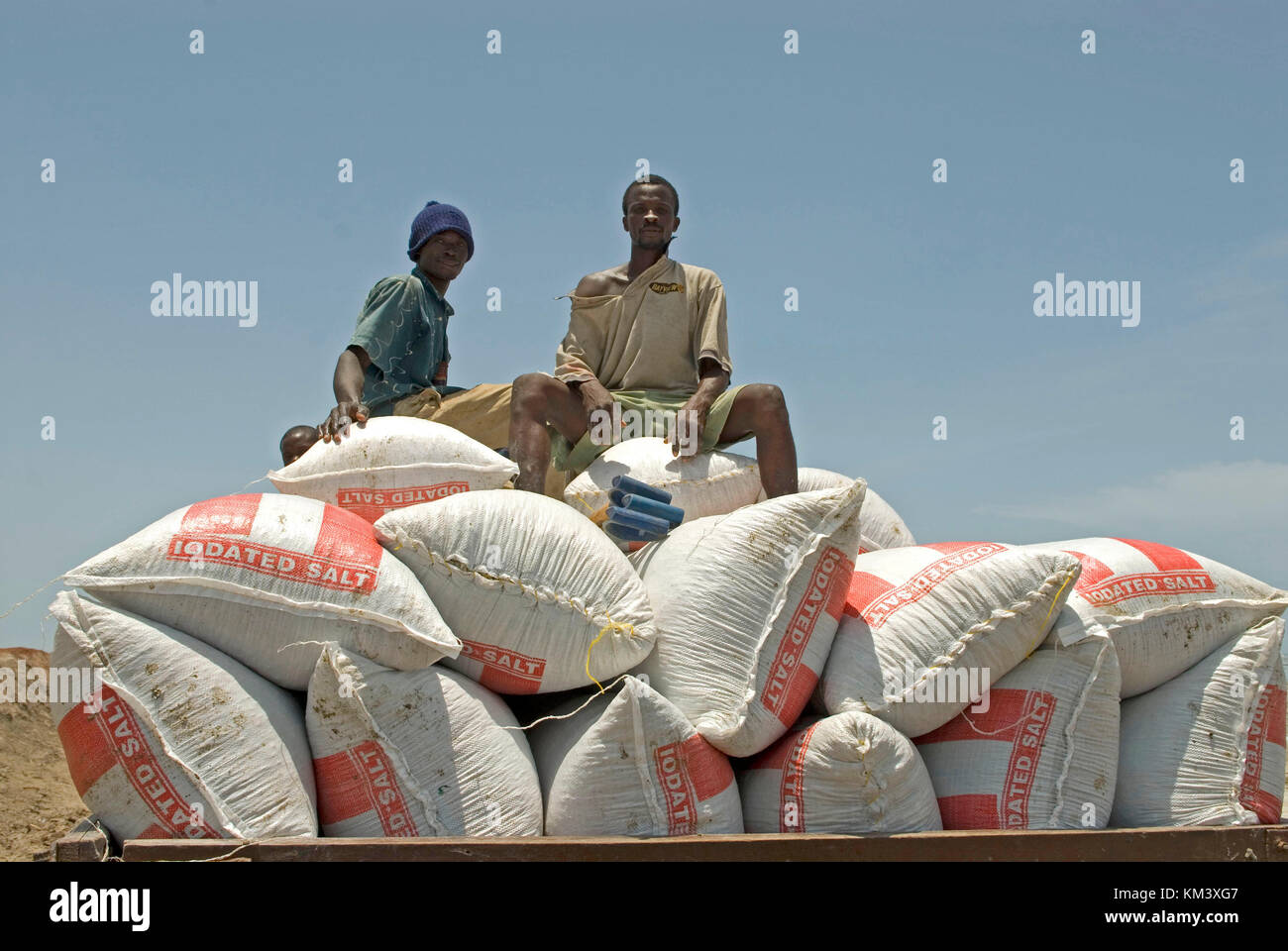 Workers picking salt in Soongor Lagoon, Ada district, Volta region ...