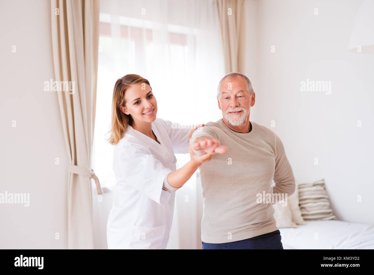 Health visitor and senior man during home visit Stock Photo - Alamy