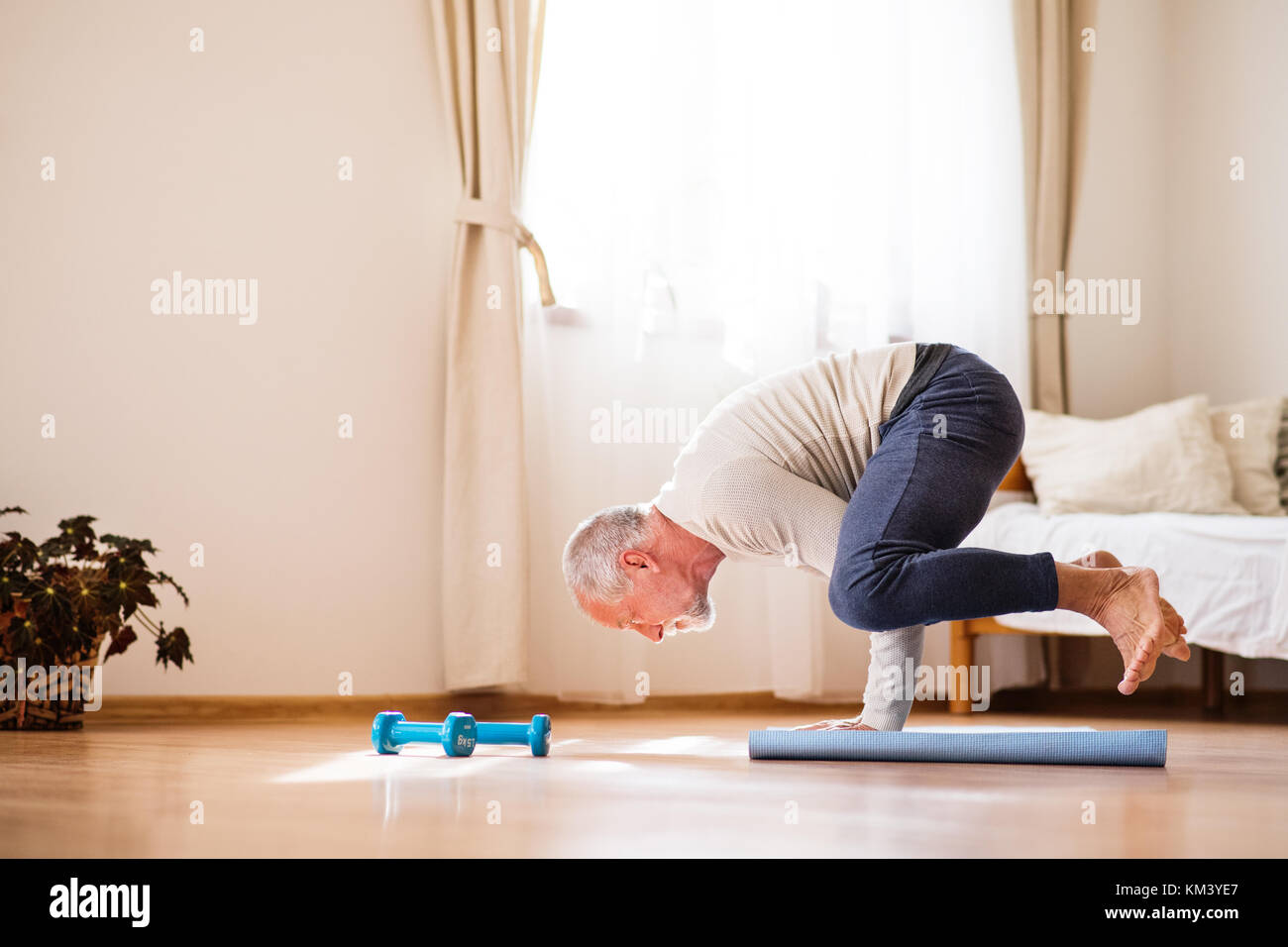 Senior man doing exercise at home Stock Photo - Alamy